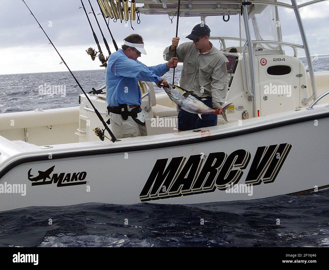George Poveromo (left) and captain Brian Cone with a blackfin tuna they ...