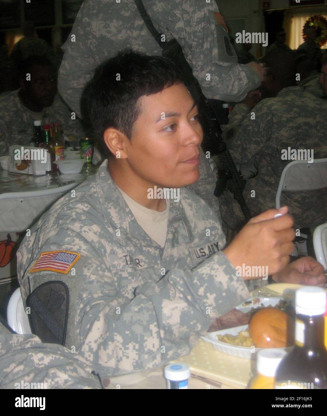 Sgt. Nuala Taylor of Savage, Minnesota, eats a Thanksgiving meal with ...