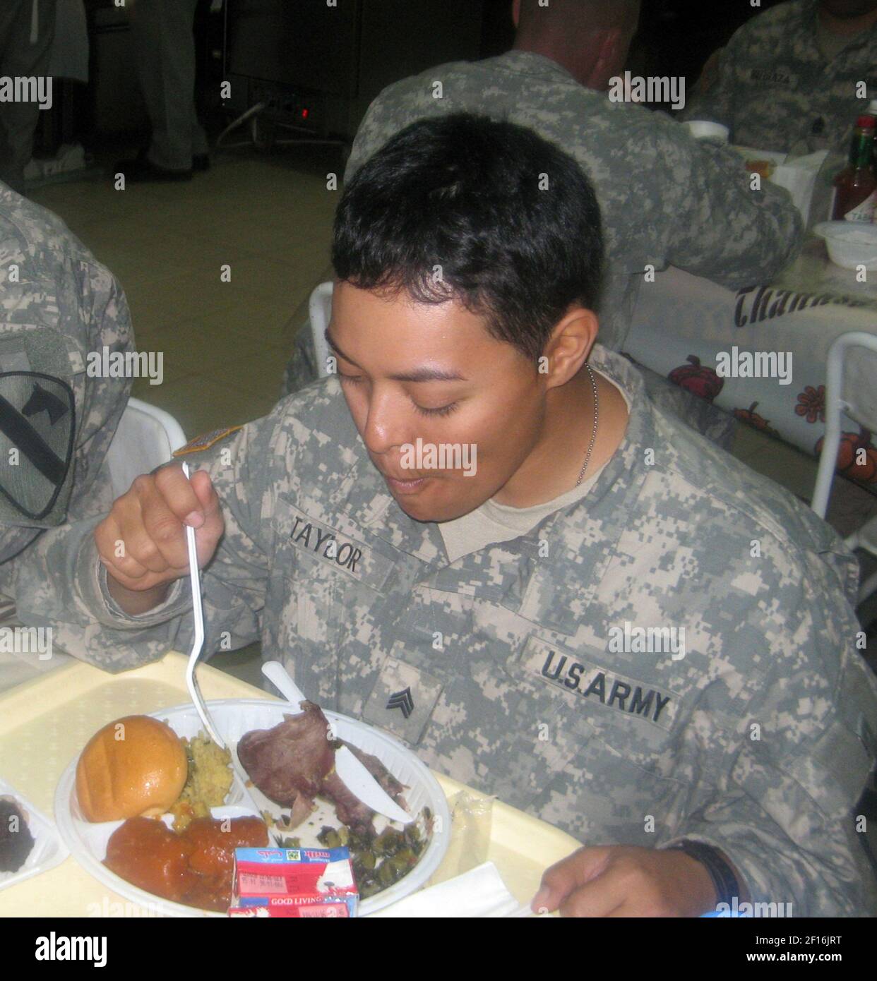 Sgt. Nuala Taylor of Savage, Minnesota, eats a Thanksgiving meal with ...