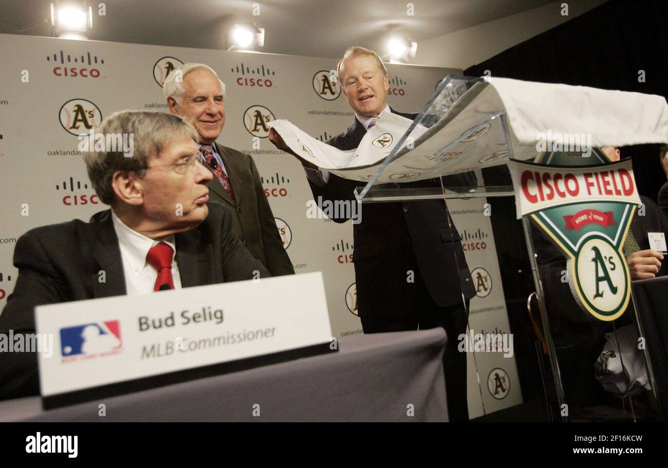 John Chambers, CEO of Cisco Systems (right) unveils the new logo for ...