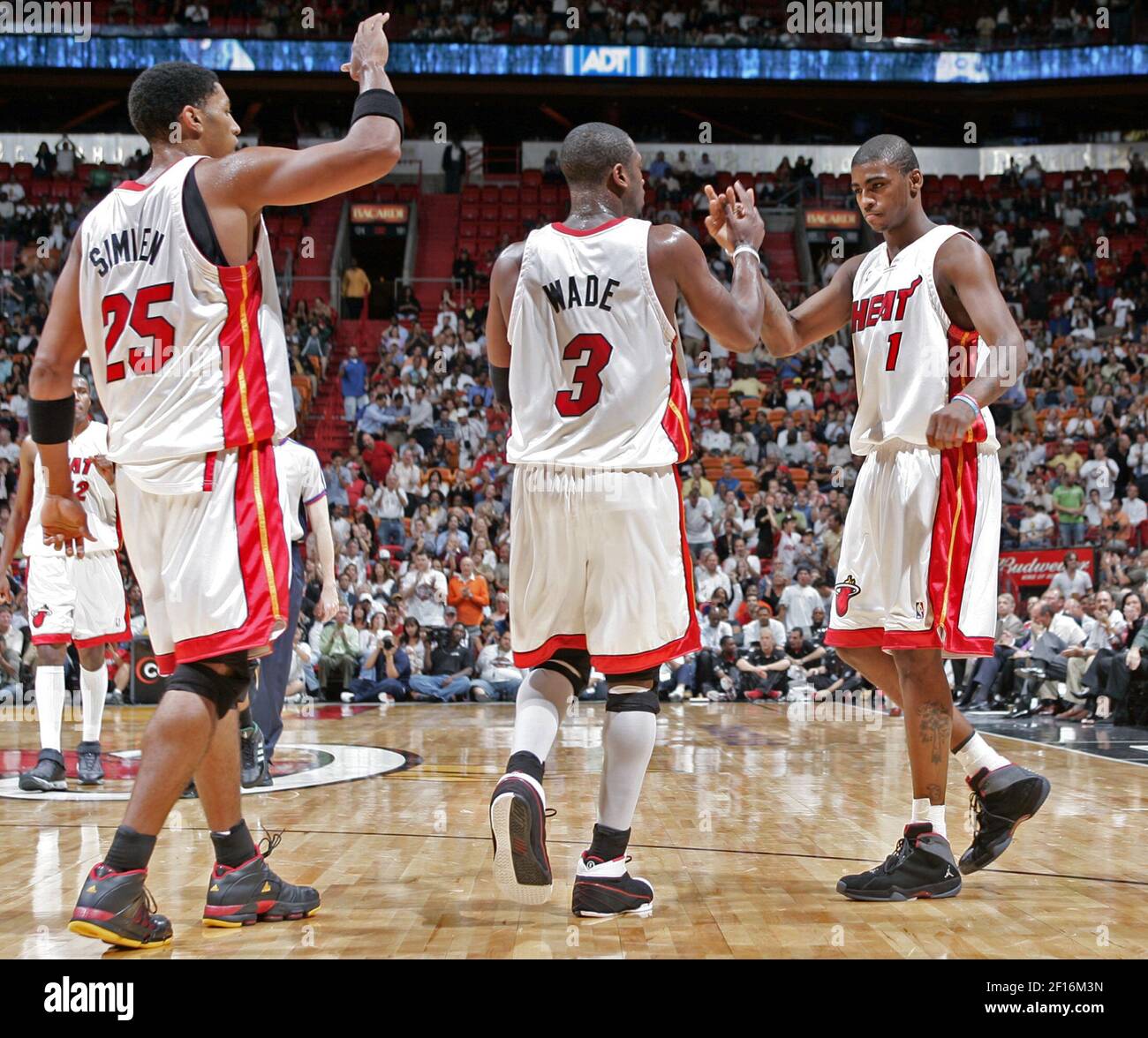 Miami Heat players Wayne Simien (25) and Dwyane Wade (3) high five ...