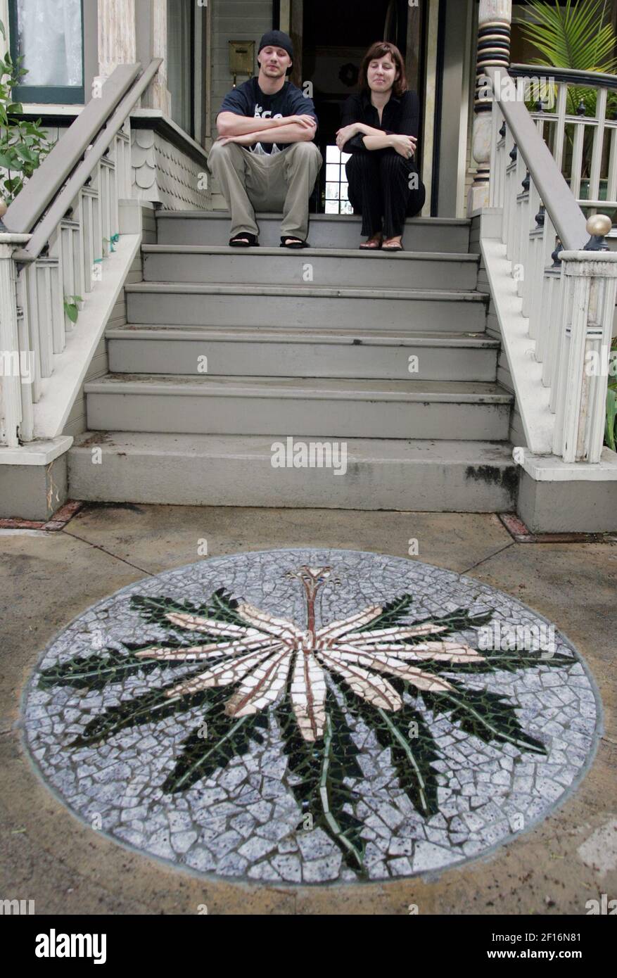 Damian Tischler, 23, (left) and Kate Horner, 24, sit on the front steps ...