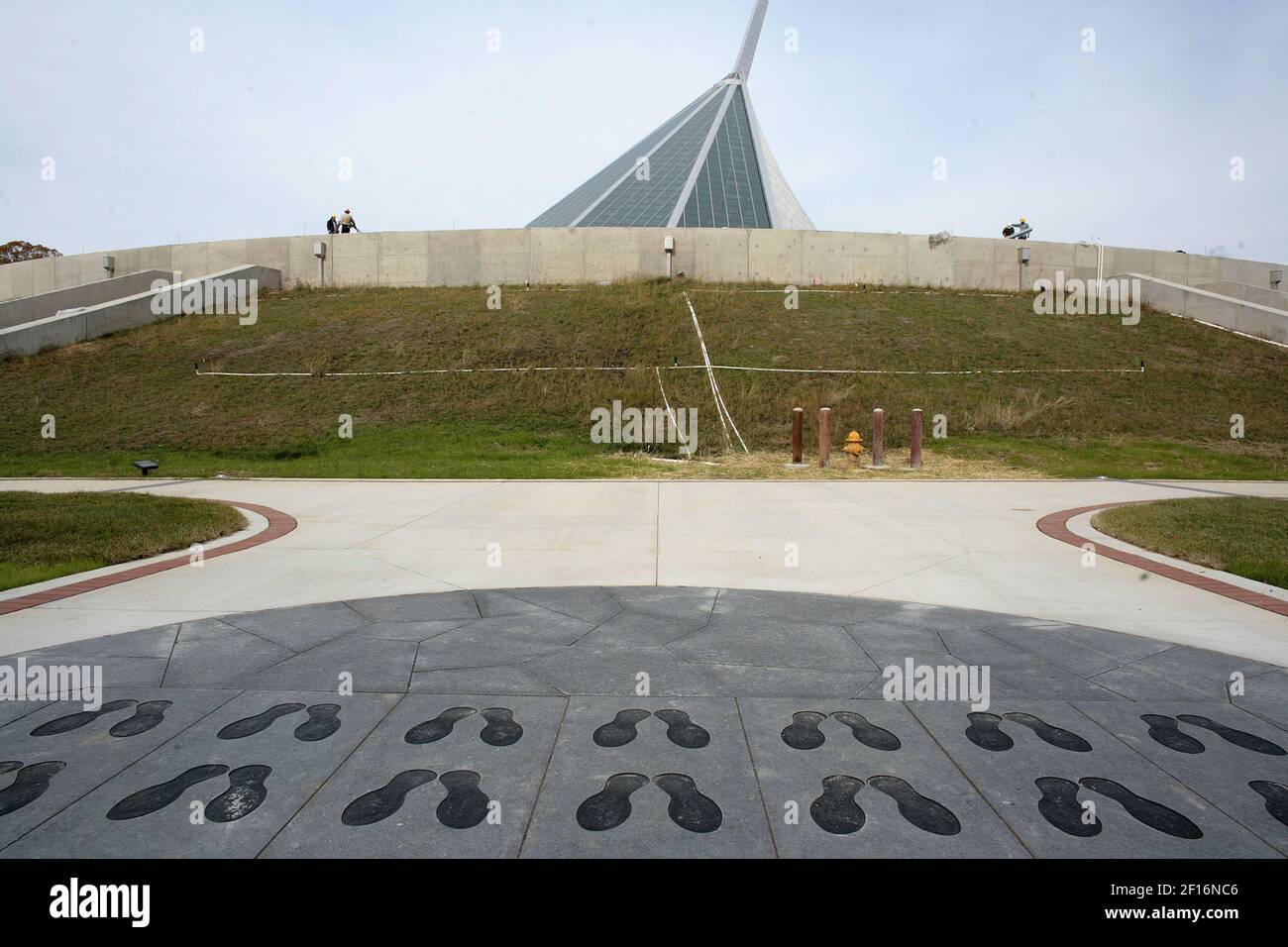 Footprints in stone show visitors how to line up in formation at the ...