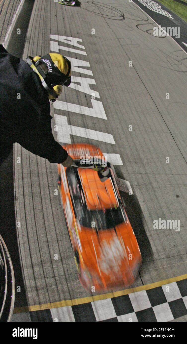 Tony Stewart takes the checkered flag in the Bass Pro Shops 500 NASCAR ...