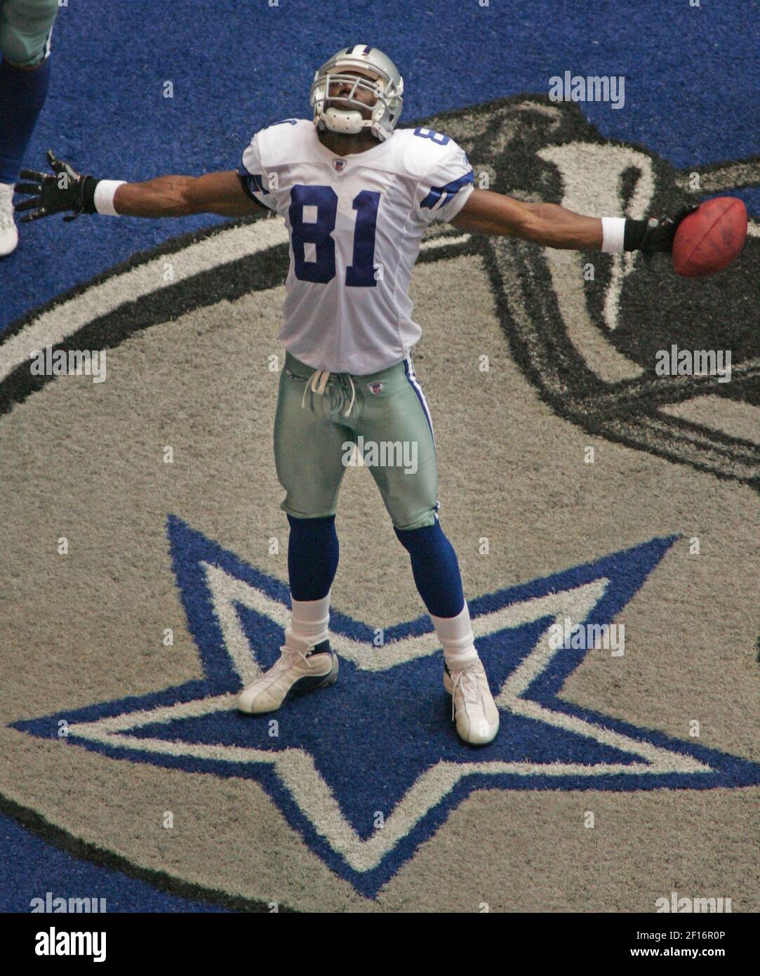 Dallas Cowboys wide receiver Terrell Owens stands on a star in the ...