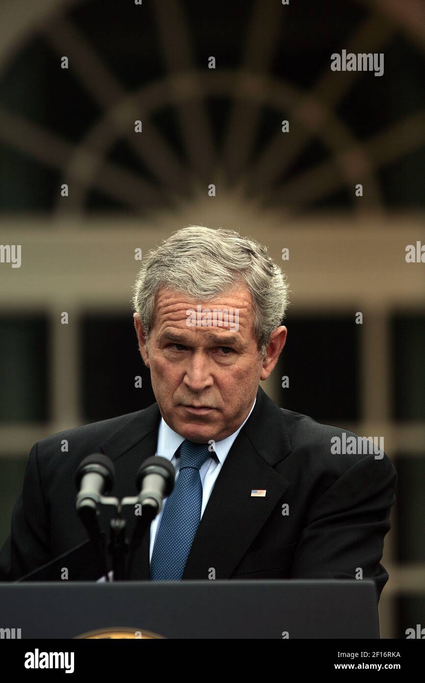 President George W. Bush holds a news conference in the Rose Garden of ...