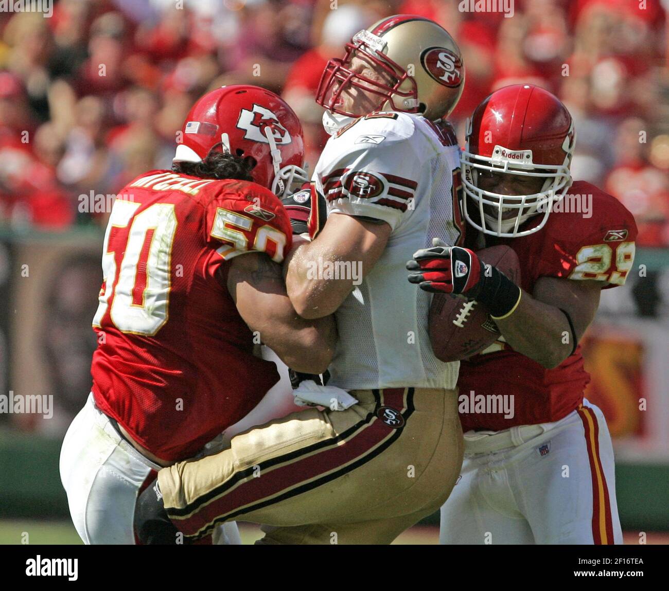 Kansas City Chiefs' Kawika Mitchell, left, and Sammy Knight sandwich ...