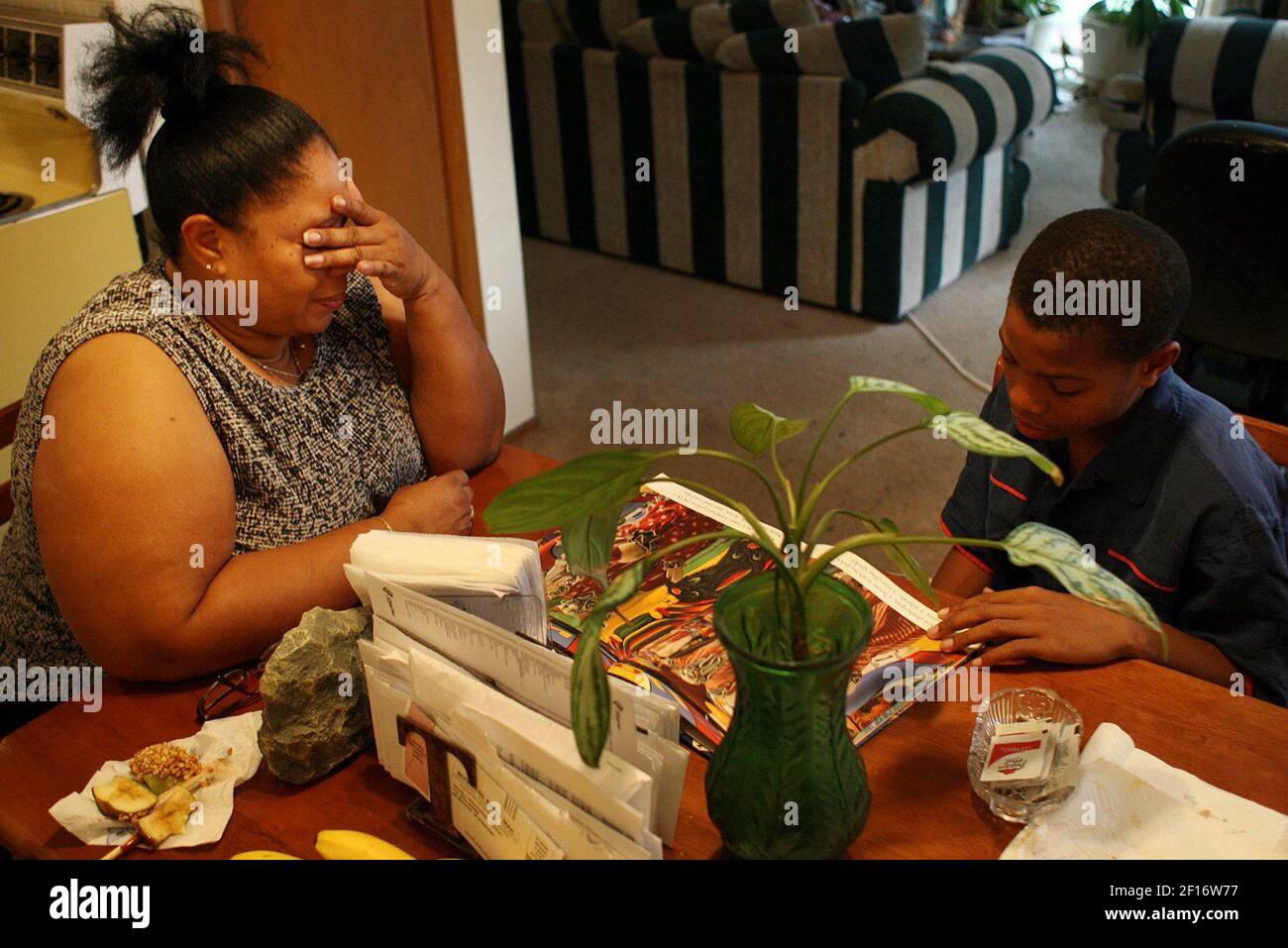 Tonetta Jenkins helps grandson Darrion Jenkins with his reading in ...