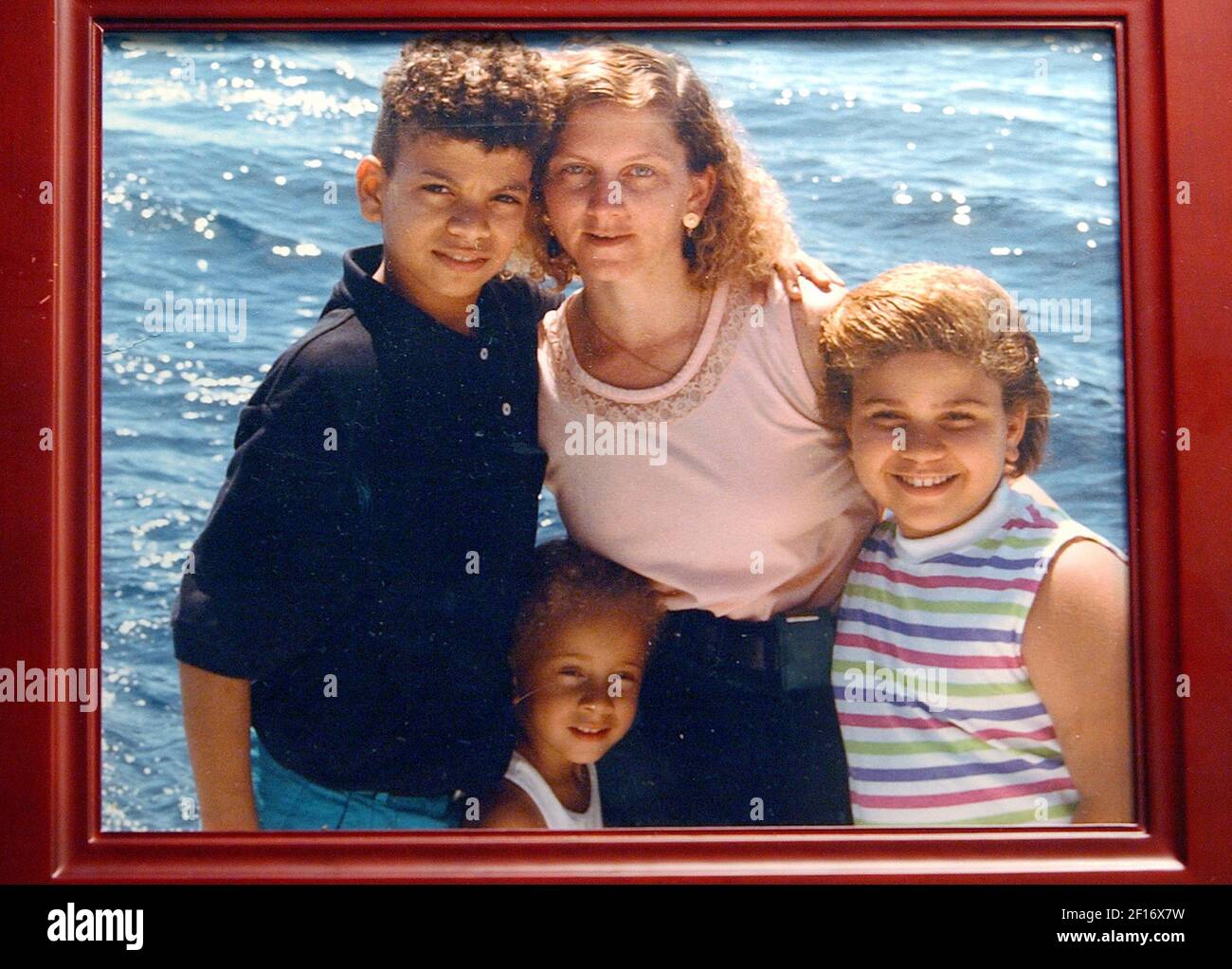 Traci Cooper, shown in a family photo with her children, was a victim ...