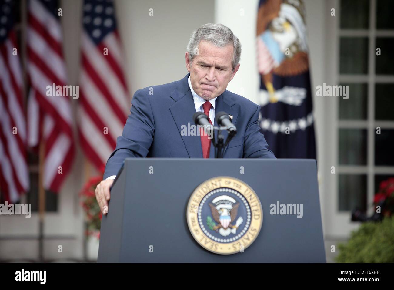 President George W. Bush holds a news conference in the Rose Garden of ...