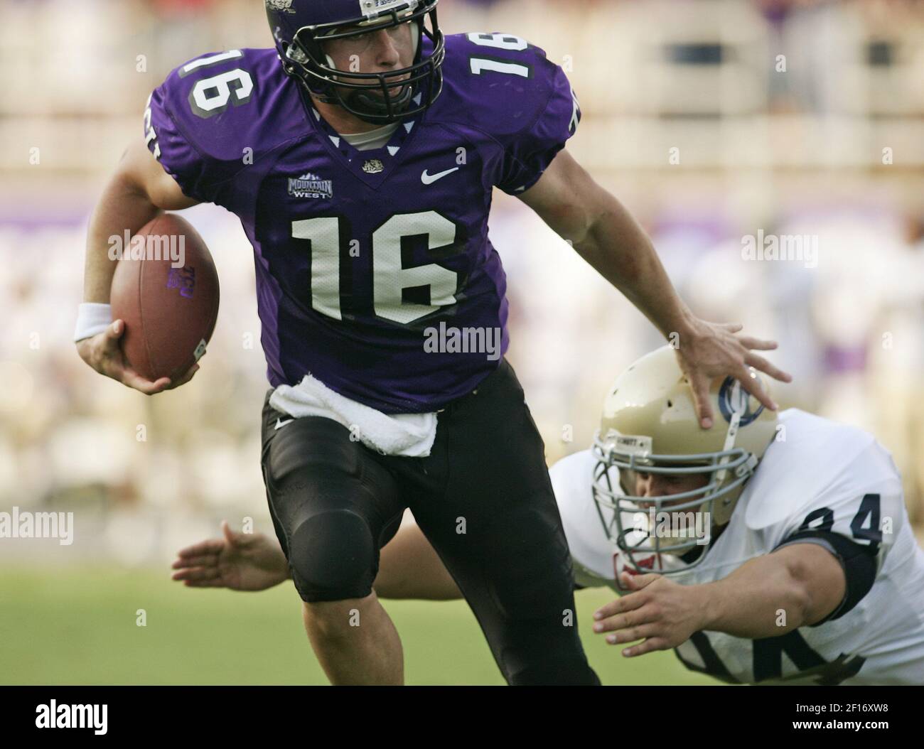 Texas Christian University quarterback Jeff Ballard (16) evades away ...
