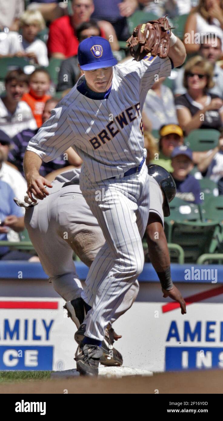 The Milwaukee Brewers' Vinny Rottino becomes tangled with the Florida ...