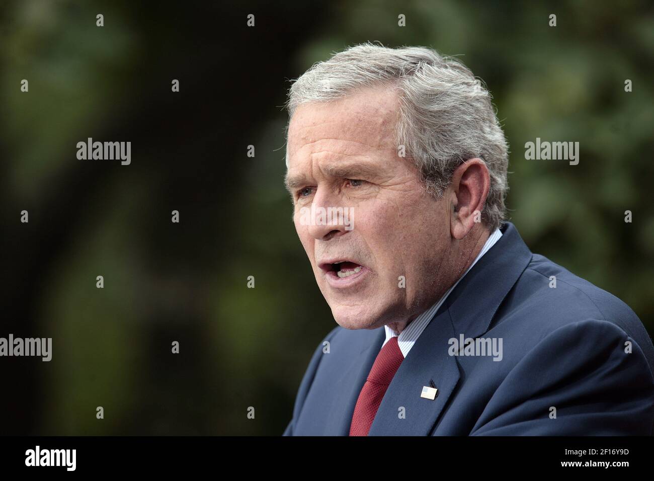 President George W. Bush holds a news conference in the Rose Garden of ...