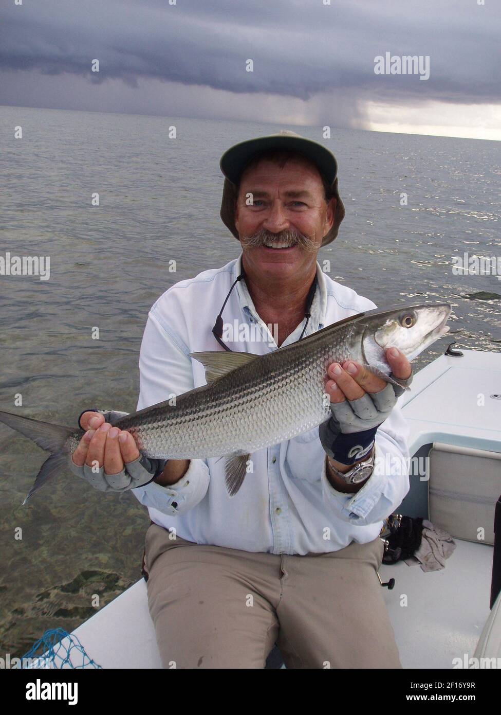 Captain Bob Branham holds an estimated 5-pound bonefish caught on a fly ...