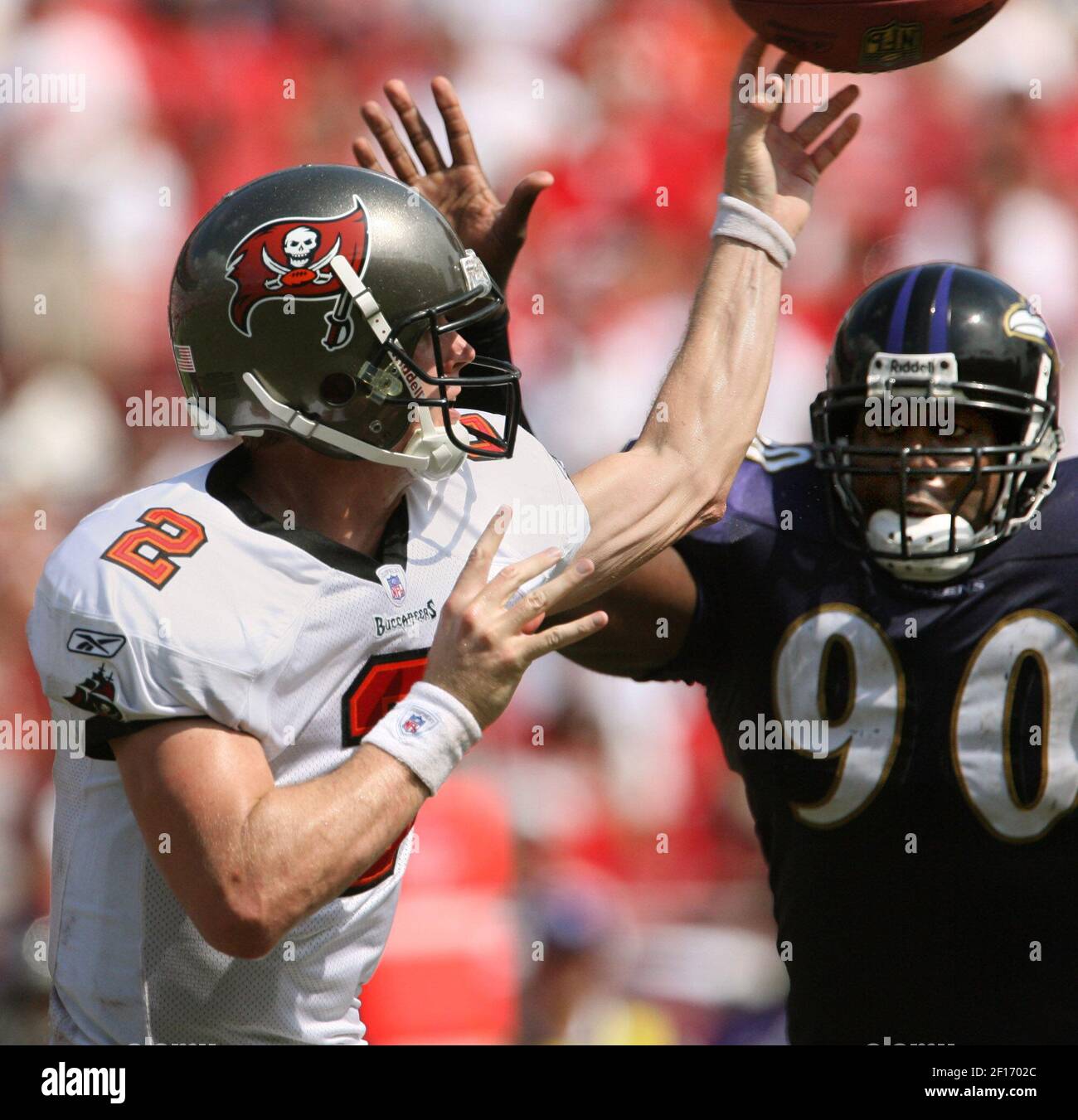 Tampa Bay Buccaneers' Chris Simms (2) is pressured by Baltimore Ravens ...