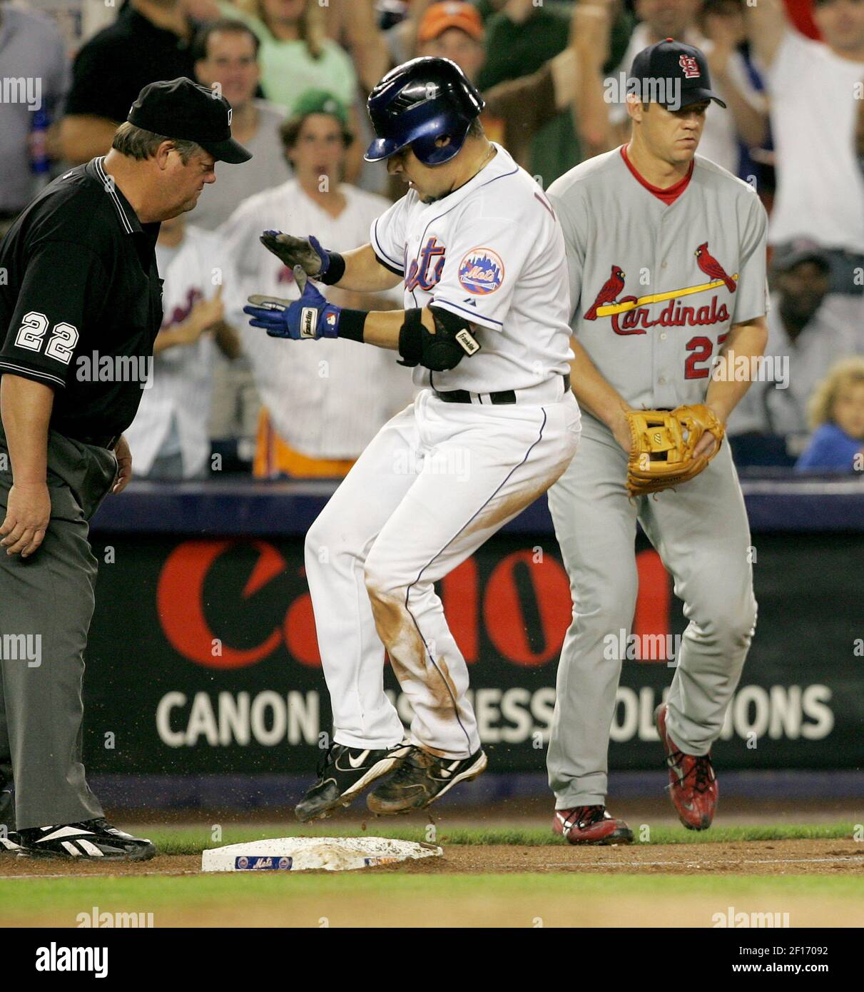 New York Mets' Paul LoDuca celebrates as third base umpire Joe West ...