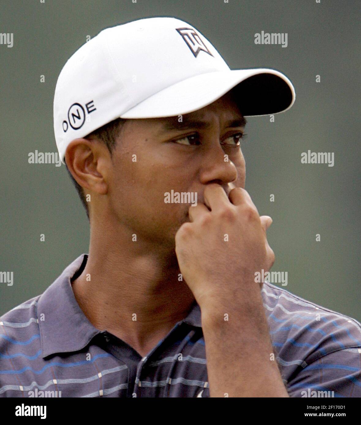 Tiger Woods hit his approach shot at the ninth hole onto the roof of ...