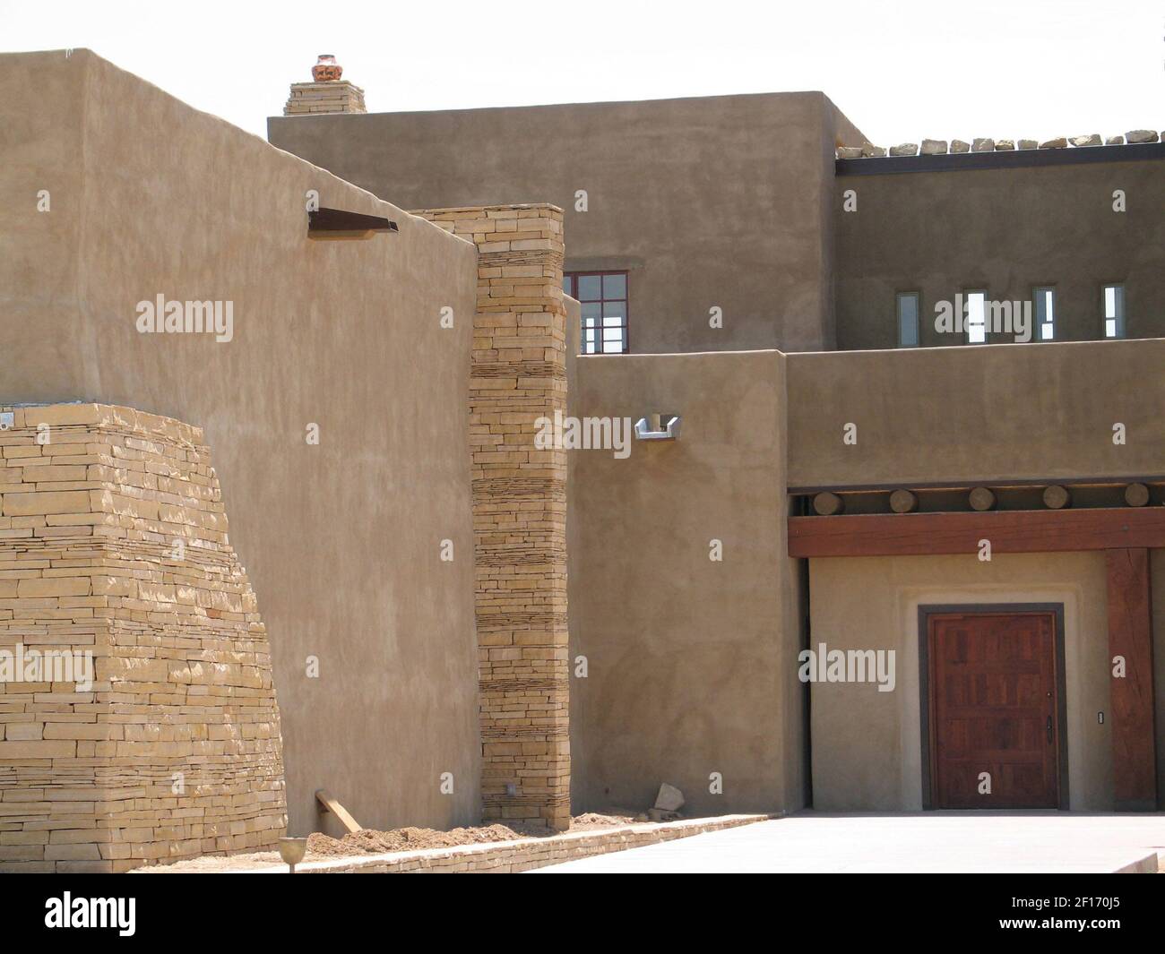 The Sky City Cultural Center incorporates stacked-stone, adobe and beam ...