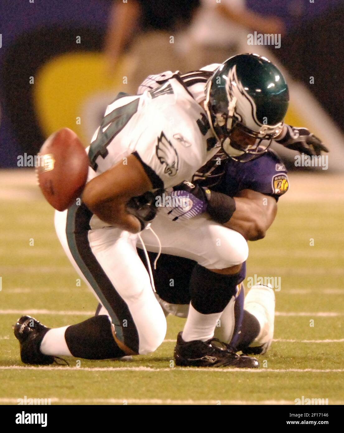 The Philadelphia Eagles' Reno Mahe (34) fumbles as he is hit by the ...