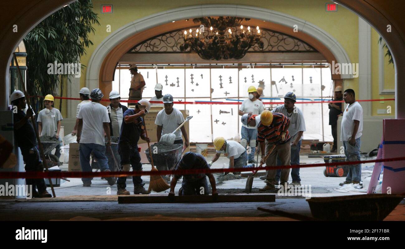 Workers finish a floor, July 26, 2006, at Beau Rivage casino in Biloxi ...