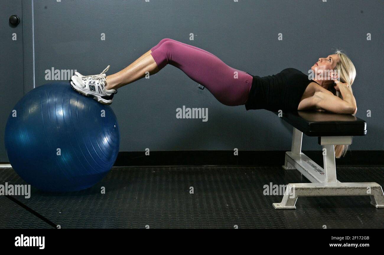 Nancy Cole demonstrates the Swiss ball bridge at the Body and Soul Gym ...