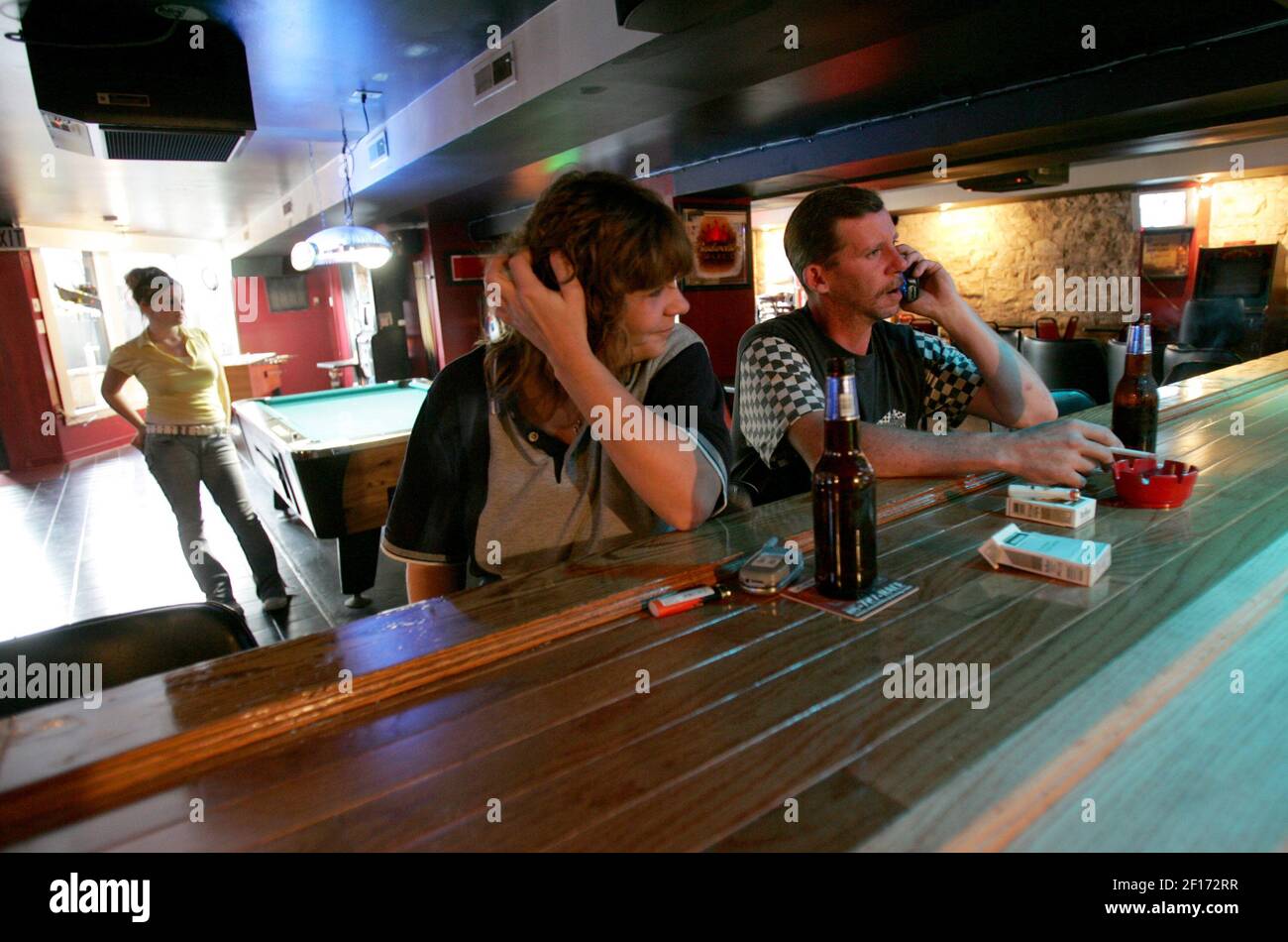 South Elgin Marathon gas station manager Michelle Vargo, center, is ...