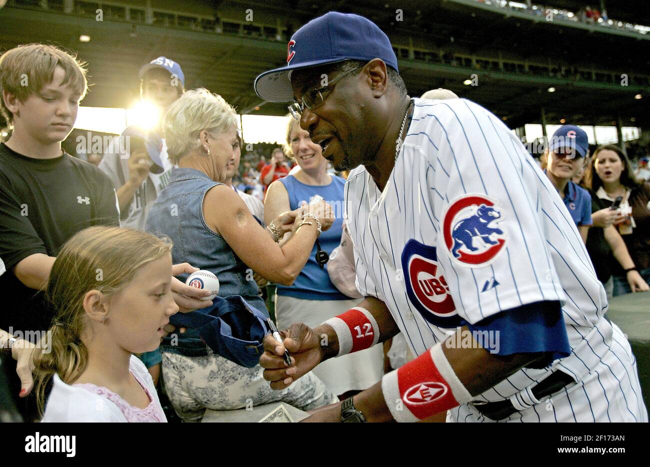 Chicago Cubs' manager Dusty Baker signs autographs for fans before the ...