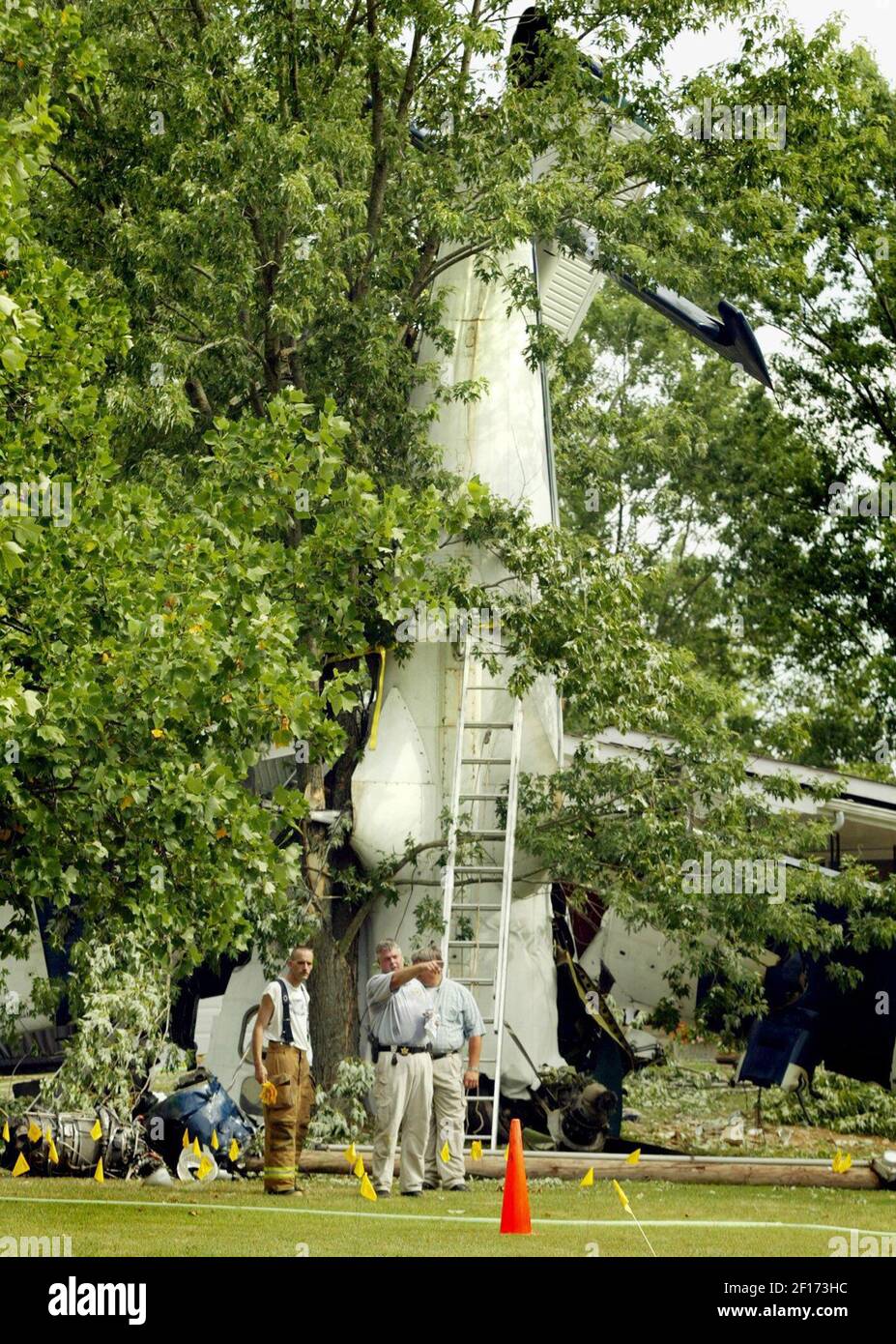 Rescue workers examine the site of a plane crash, July 29, 2006, near ...