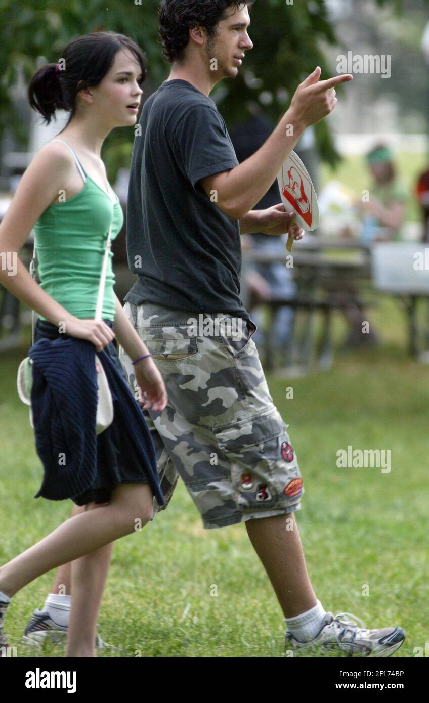 Raquel Pardo, 15, left, and Nick Davies, 18, both of St. Louis, arrive ...