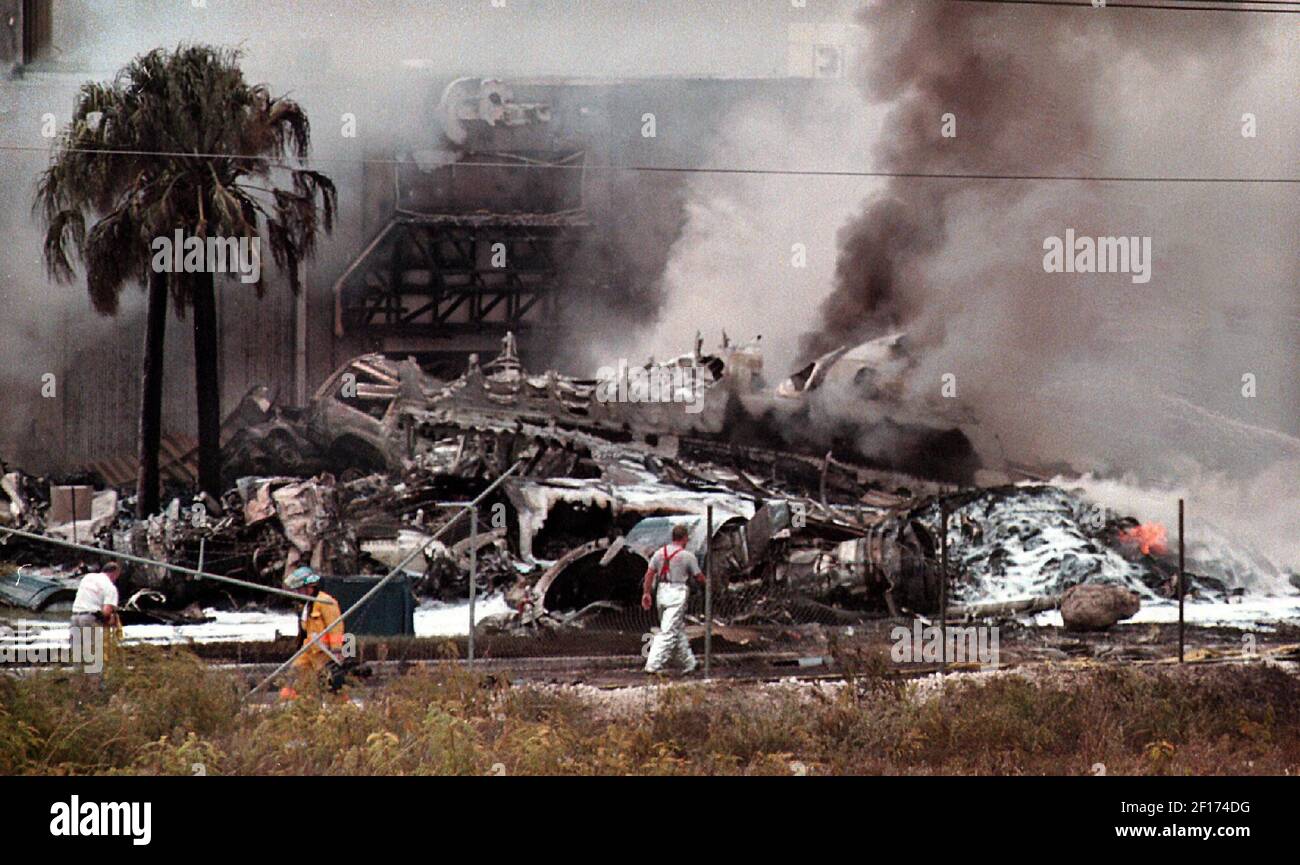 Overview of a Fine Air cargo plane crash as seen from the top of a warehouse, August 7, 1997 ...