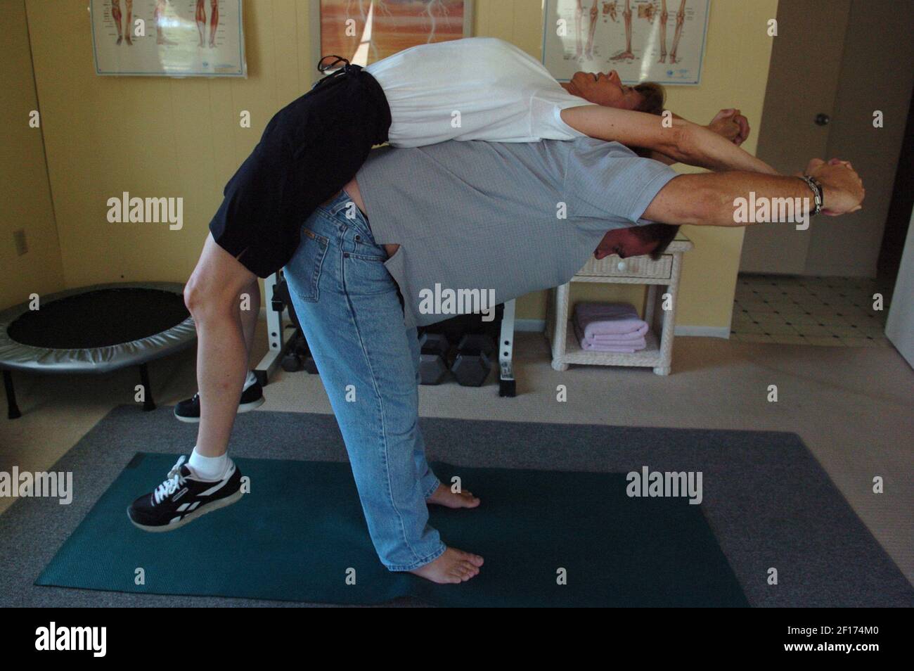 Massage therapist Lou Klinker uses his body to help maximize the ...