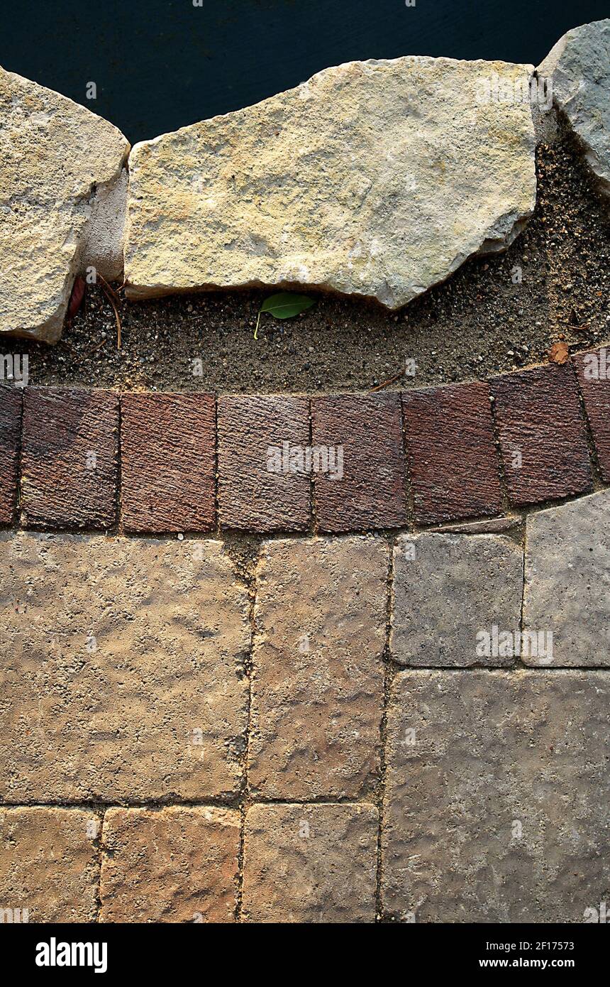 Holland pavers and natural stone are used on the patio at the home of ...