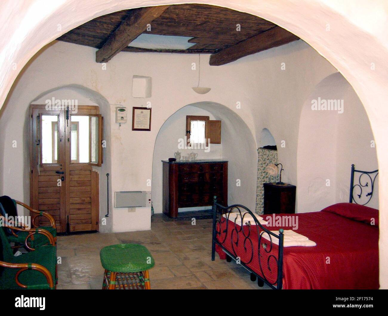 The interior of a 500-year-old rental trulli features stone floors and ...