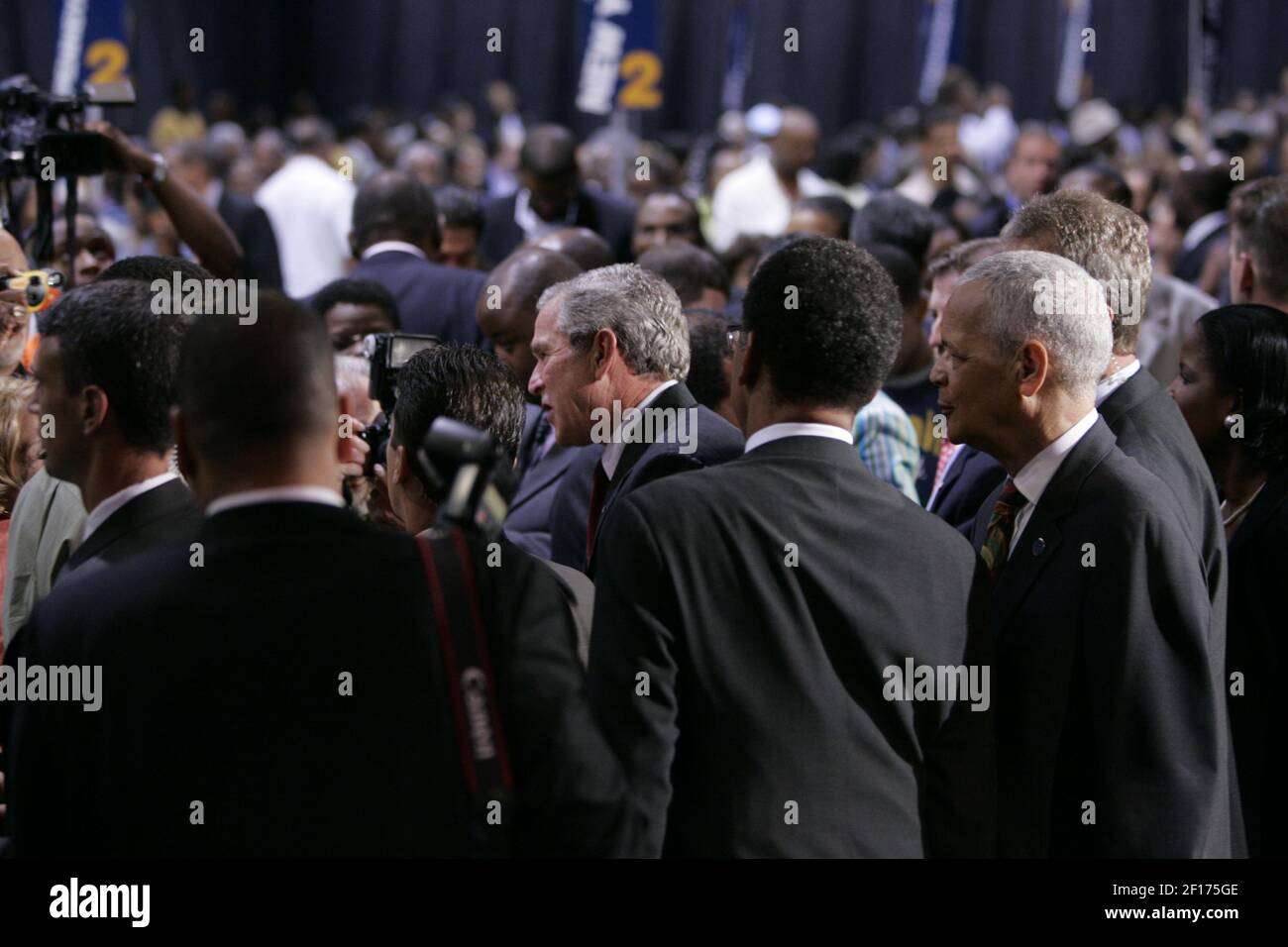 U.S. President George W. Bush walks through the crowd after addressing ...