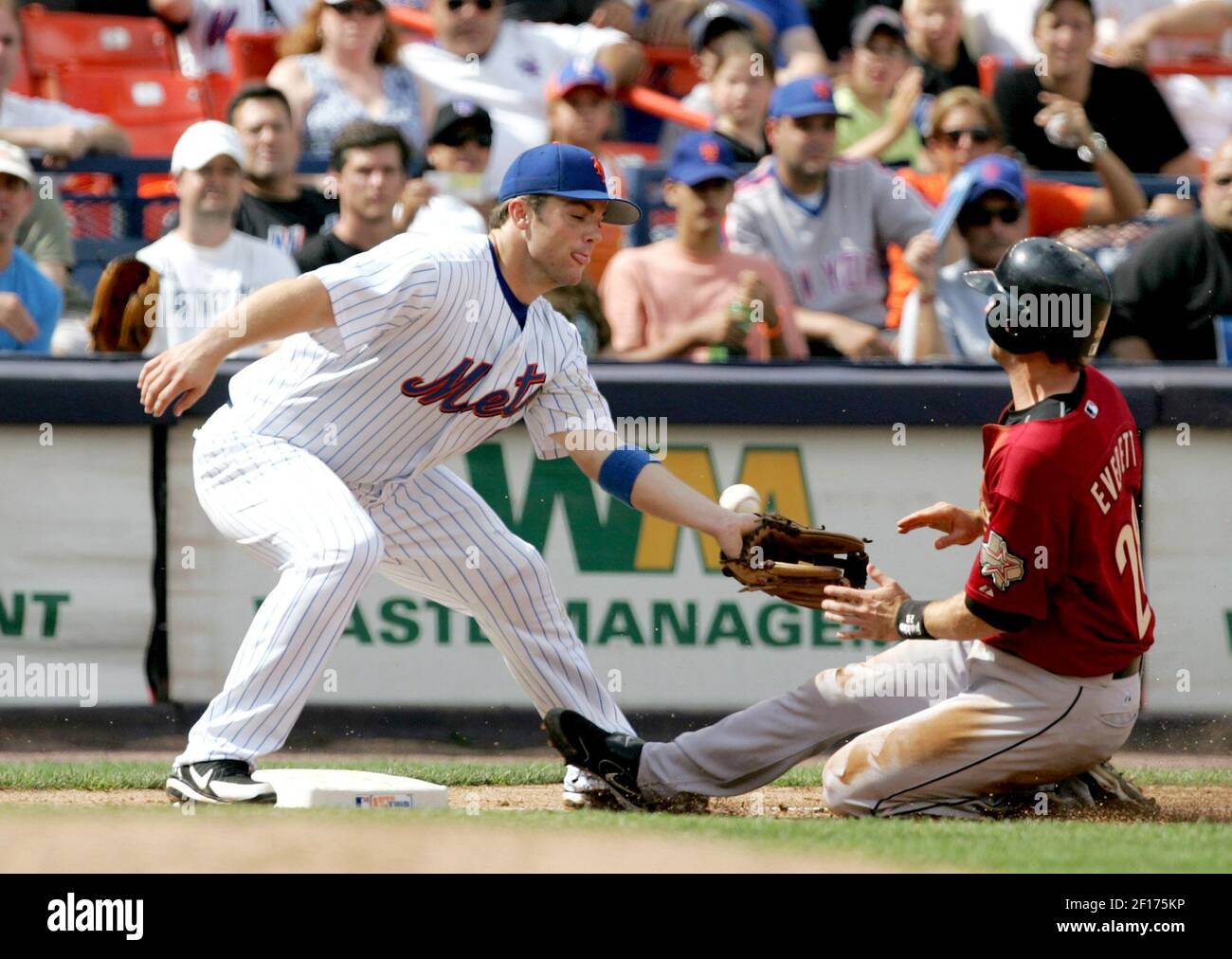 Houston Astro's Adam Everett slides safely into third base as New York ...