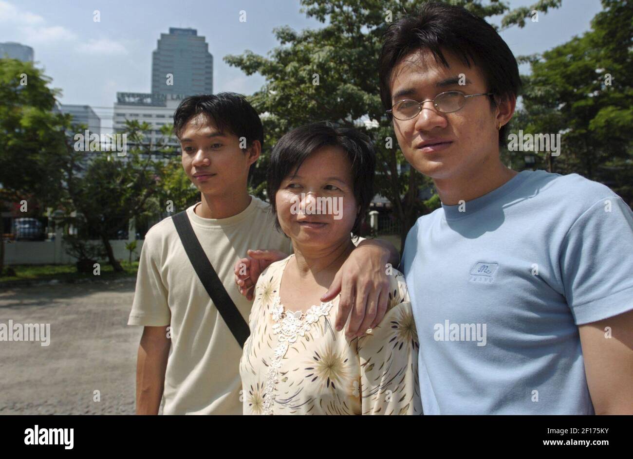 Kyin Than's family lives illegally in Bangkok. From left, son, Aung ...