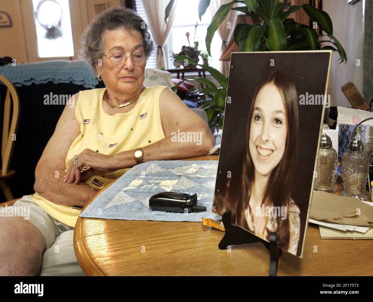 Rossie Moseley sits near a photograph of her daughter, Pamela Moseley ...
