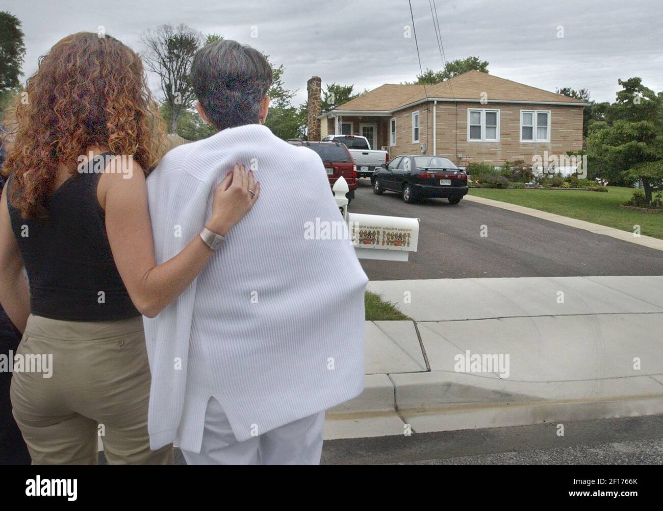 Lara Lennon, left, and Barbara Ward, look in 2005 at the spot in Ferndale, Maryland, where in ...