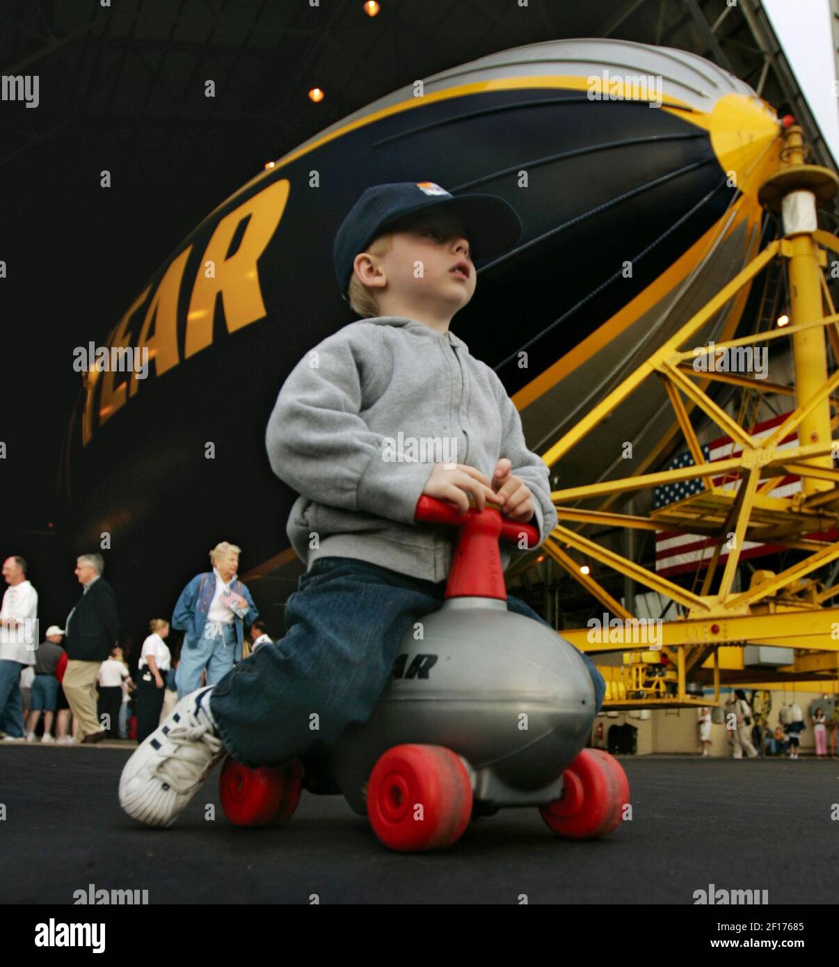 Luke Reynolds, 3, rides his model Goodyear blimp as the latest in the ...