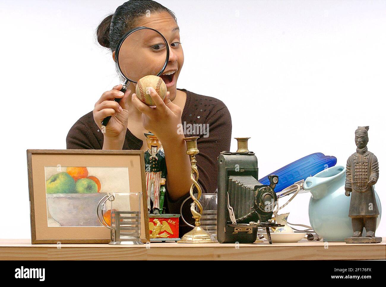 This photo illustration shows how to check out items at a yard sale ...