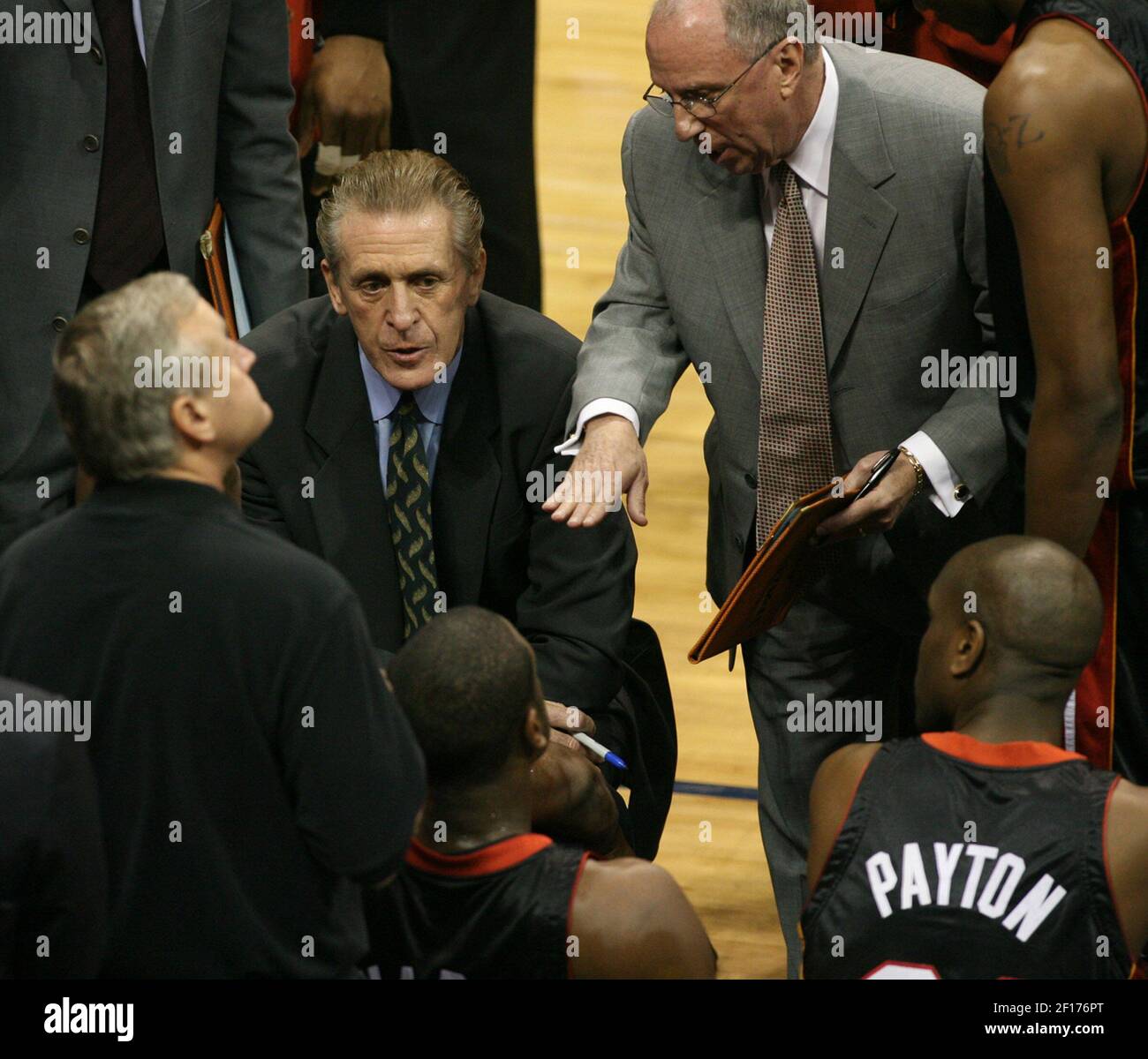 Miami Heat coach Pat Riley talks to his team during a time out in Game ...