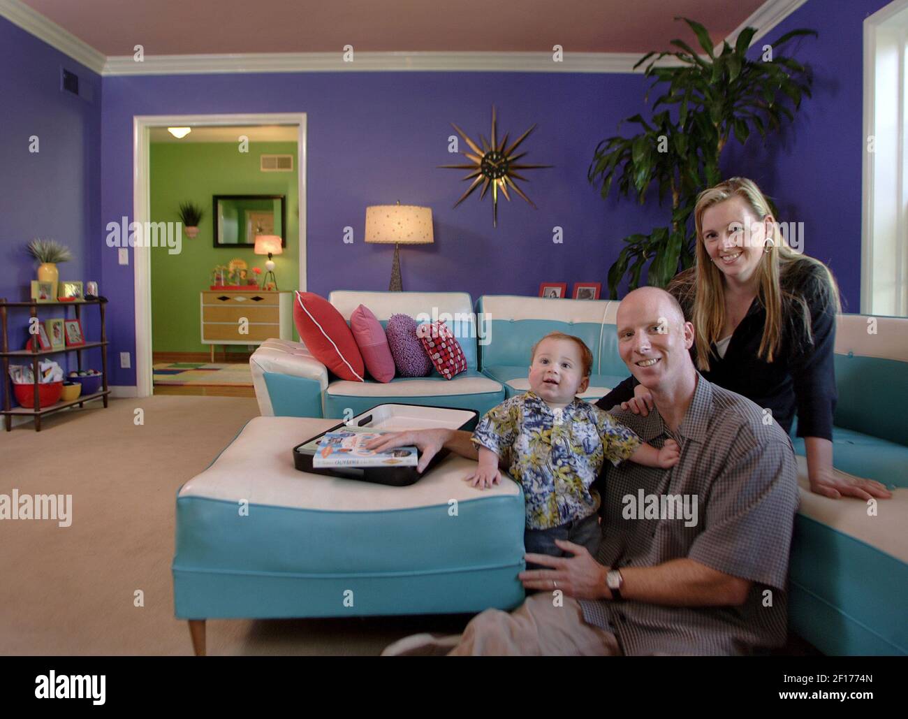 Dan Harrison, front, wife Jennifer and son Zackery pose for photograph ...