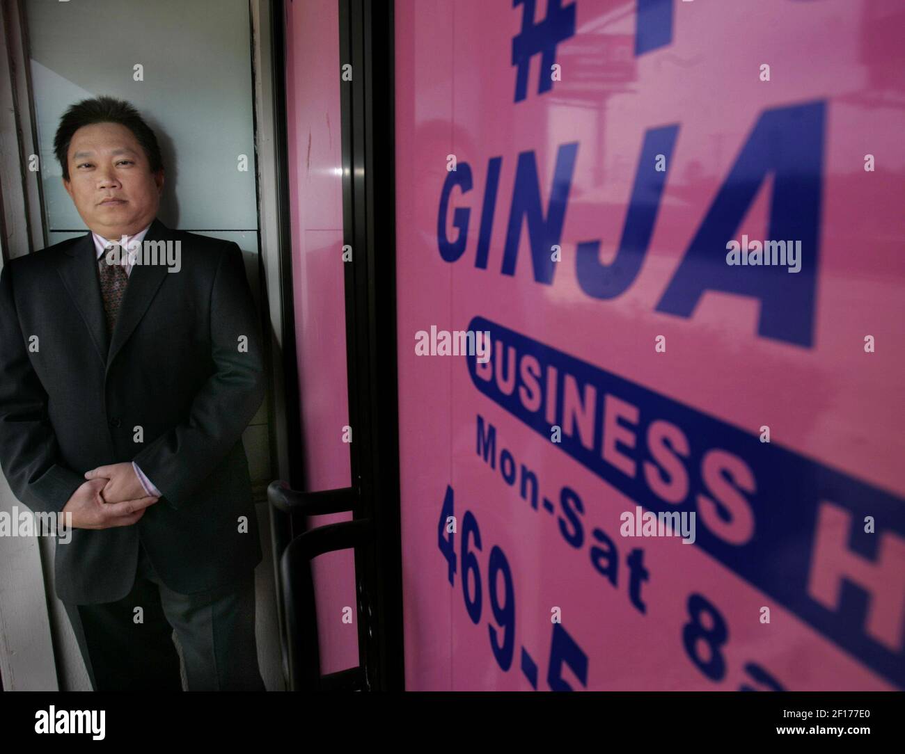 Attorney William Chu stands near the entrance to one of the eight Asian ...