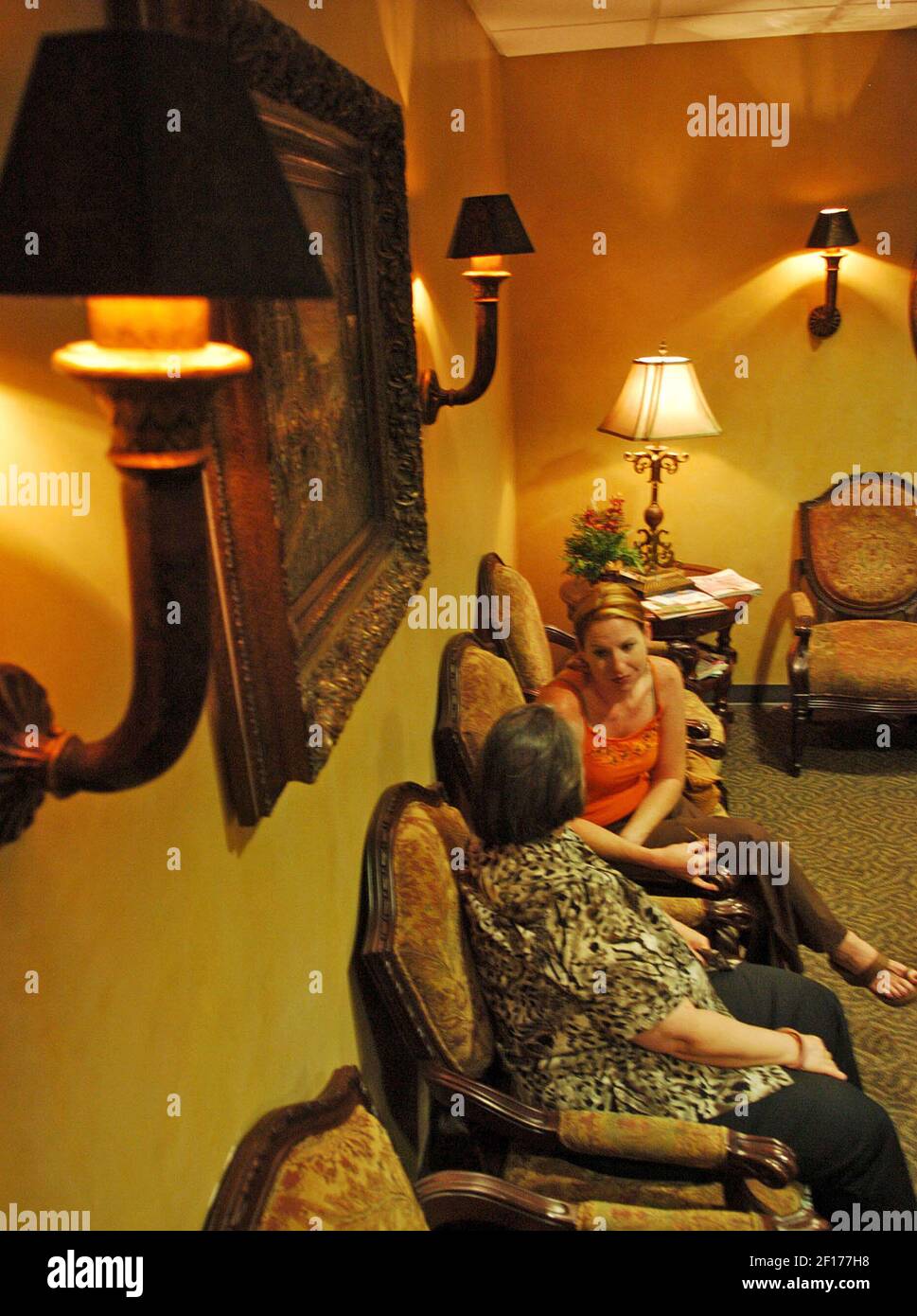 Cala Hesse (left) and Diana Mackay talk as they wait in the reception ...