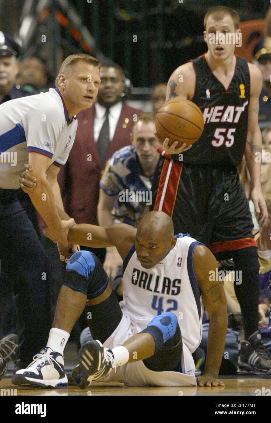 The Dallas Mavericks' Jerry Stackhouse is helped up off of the court by ...