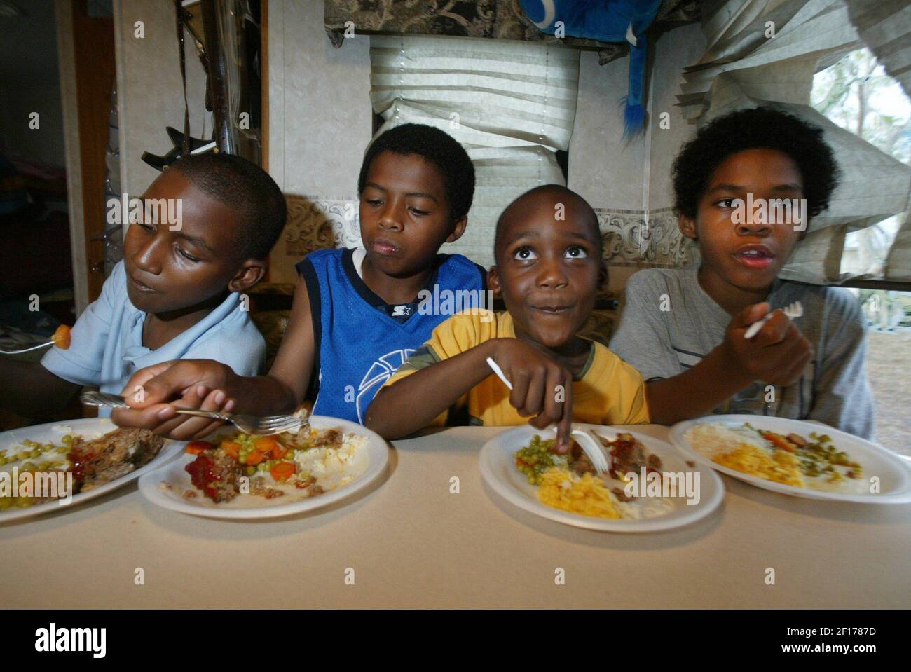Kedeem, 12, from left, Willie, 11, Keondre, 6, and Octavious, 8, eat ...