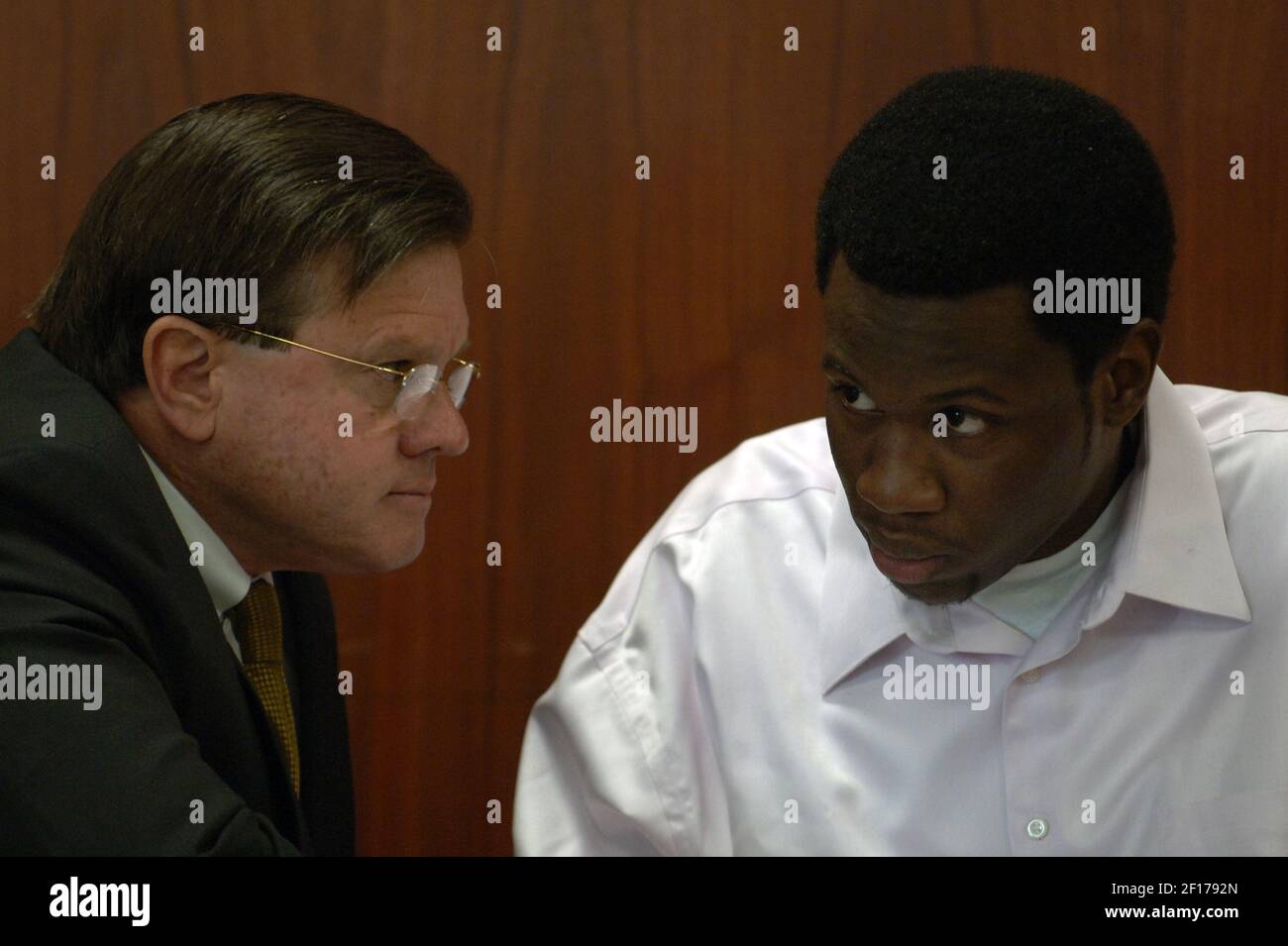 Lionel Tate confers with his attorney H. Dohn Williams (left) before ...