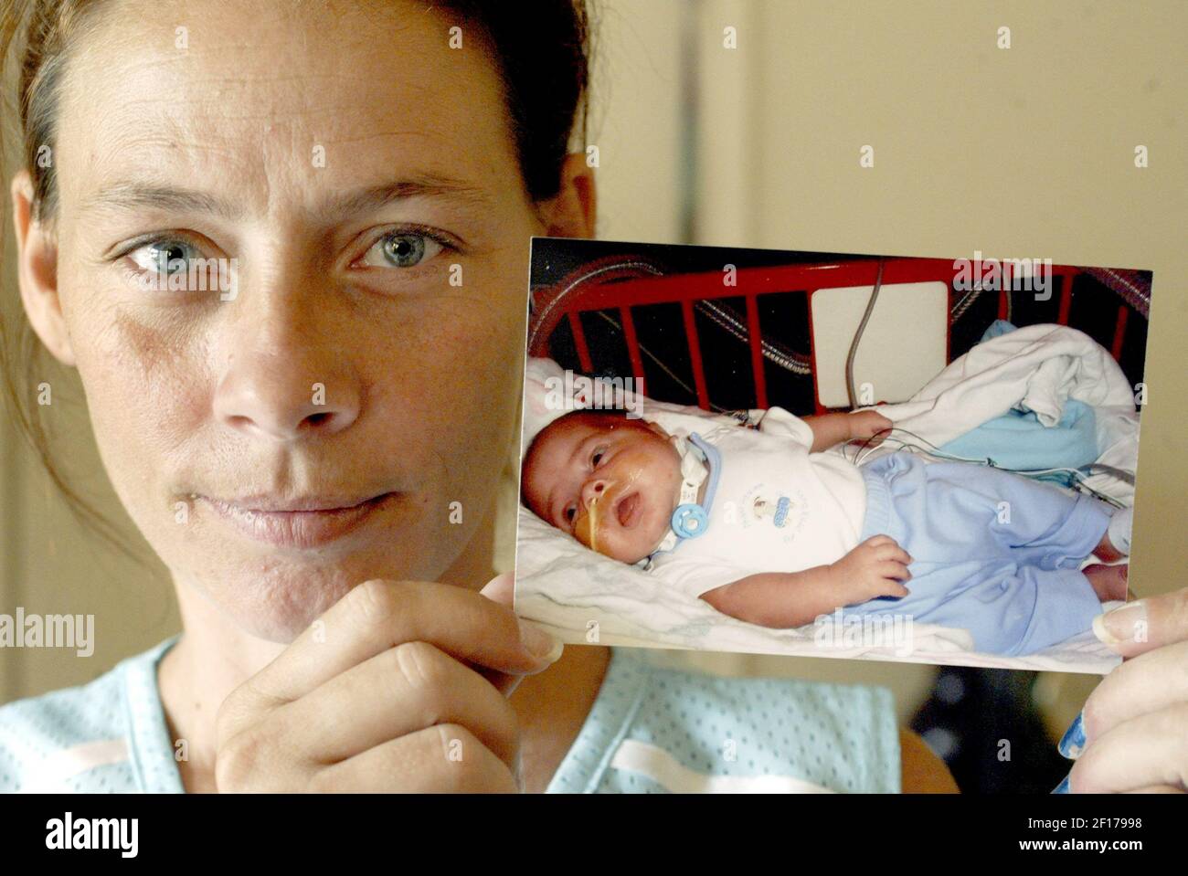Dixie Belcher of Grand Prarie holds a photograph of her son, Daniel ...