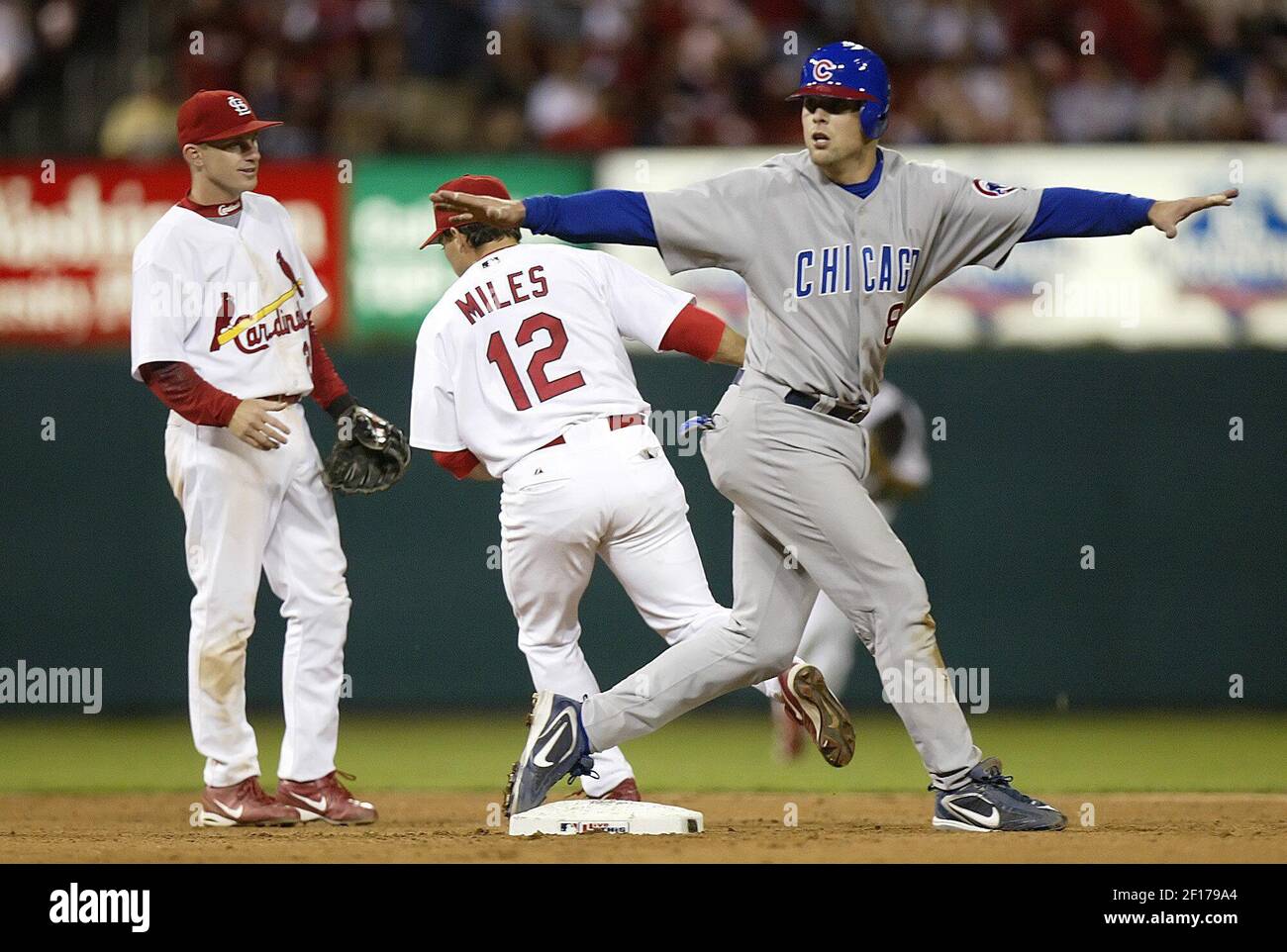 Chicago Cubs' Michael Barrett signals himself safe at second base but ...