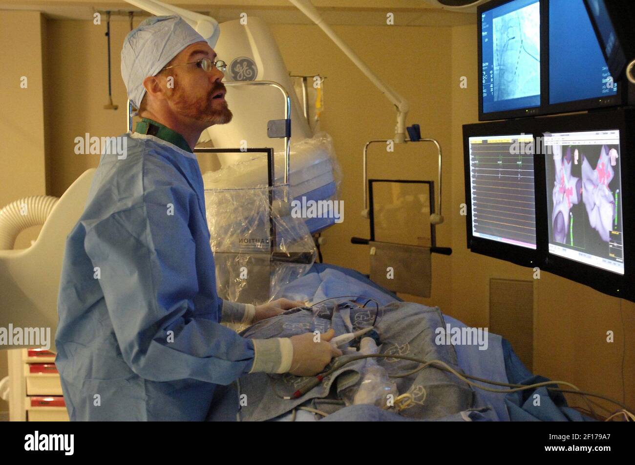 Dr. Christopher Cole performs a procedure called catheter ablation on a ...